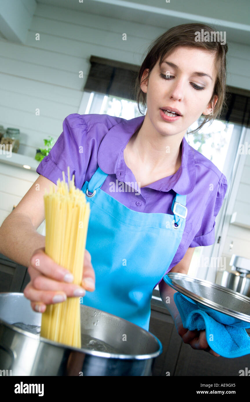 Woman cooking Pasta Stock Photo - Alamy