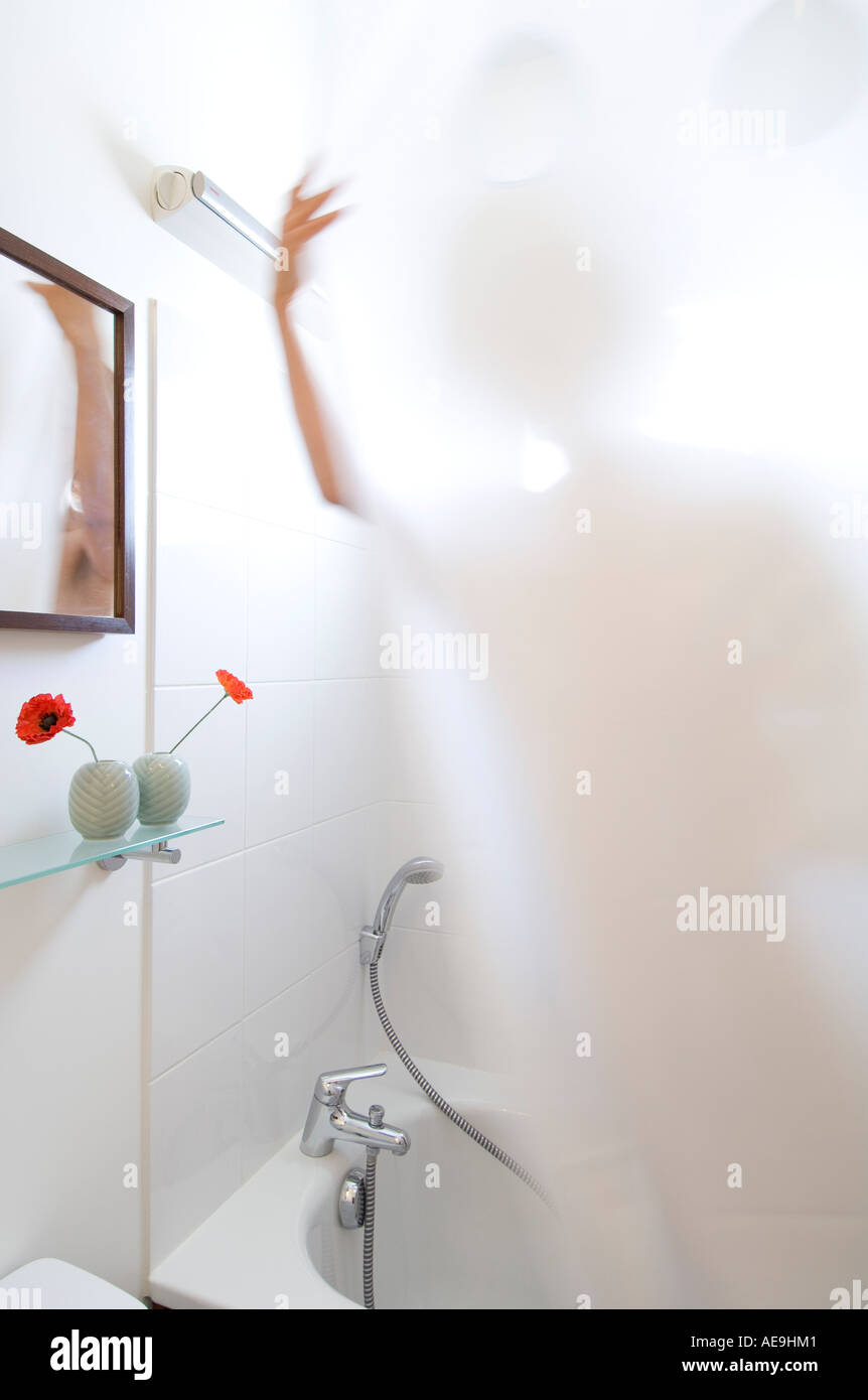 Woman taking shower through hi-res stock photography and images - Alamy