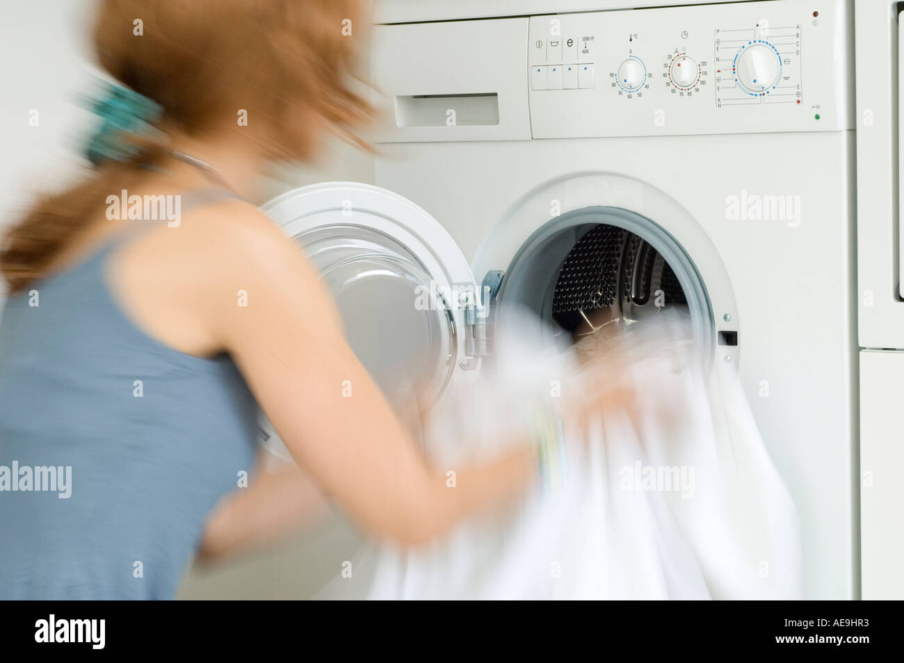 Mature woman washing machine hi-res stock photography and images - Alamy