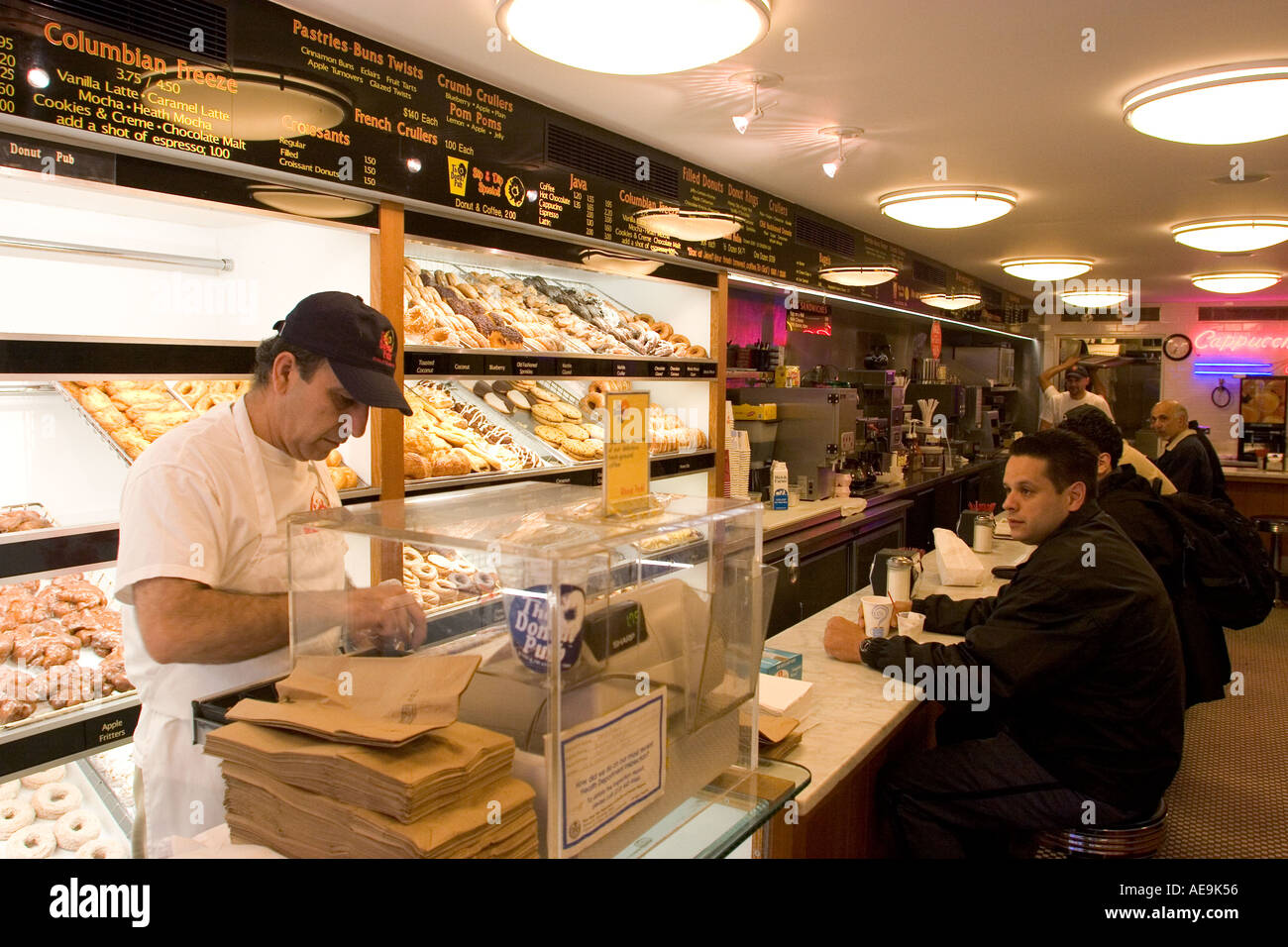Young people sitting inside a cafe Manhattan ny usa Stock Photo - Alamy