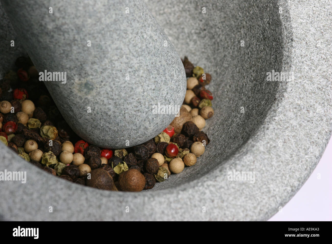 0217 Mixed Pepper Corn in a Pestle and mortar 8 Stock Photo - Alamy
