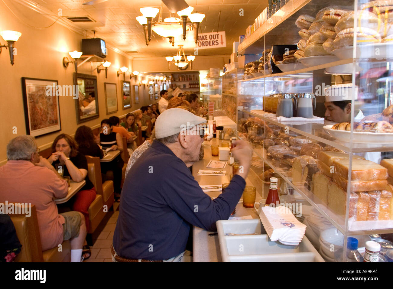 People sitting inside Viand a traditional NY deli Manhattan ny usa ...