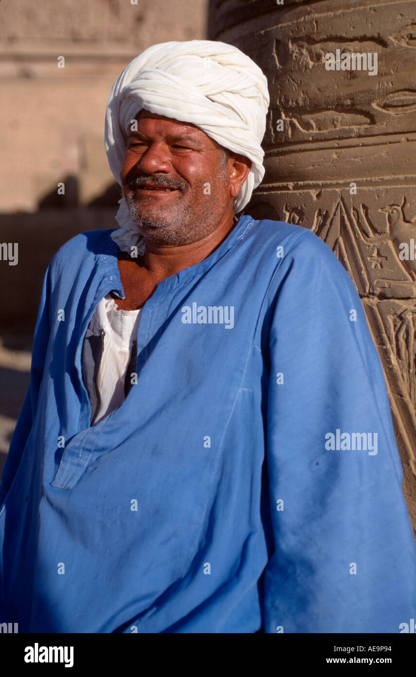 Egyptian guard in a blue Jelabiya and white turban at the Temple of ...