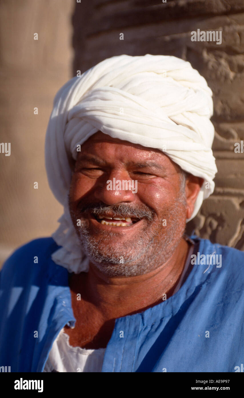 Egyptian guard in a blue Jelabiya and white turban at the Temple of ...