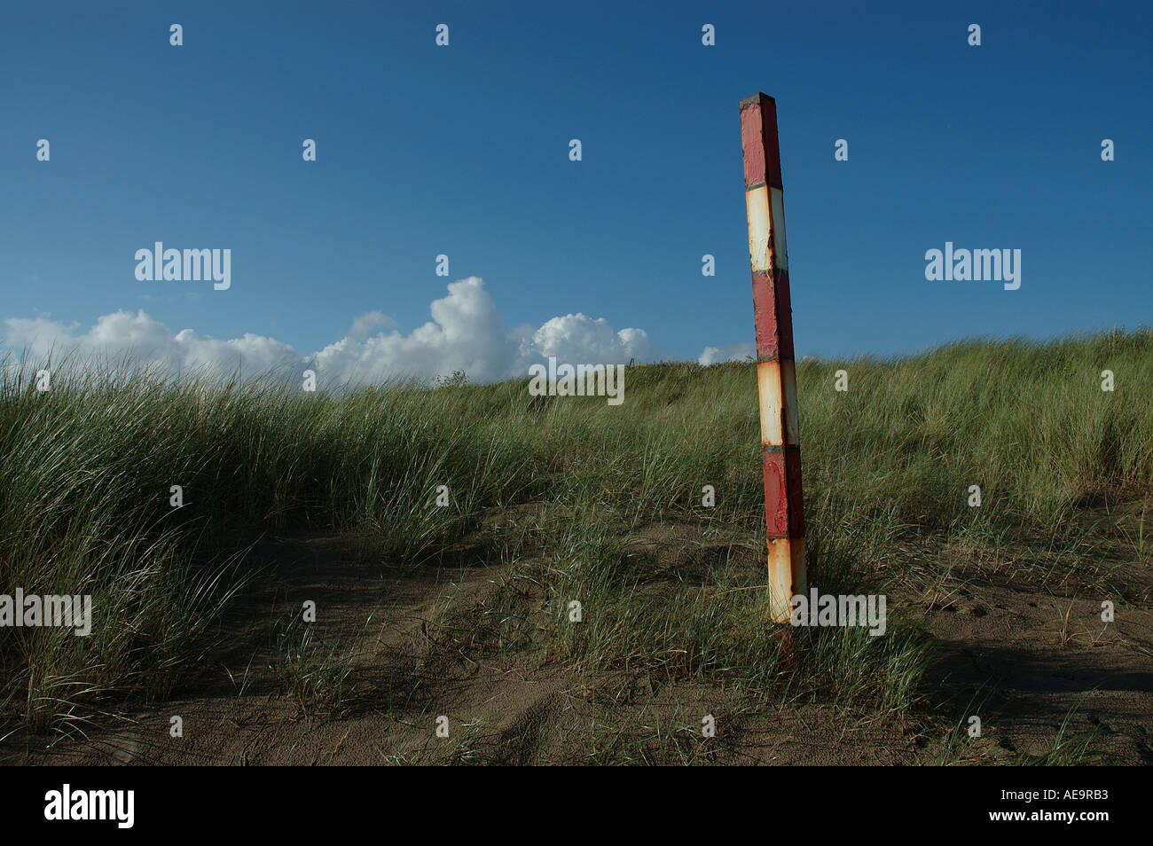 Pole in the ground in Pembrey National Park Sand Dunes Stock Photo - Alamy