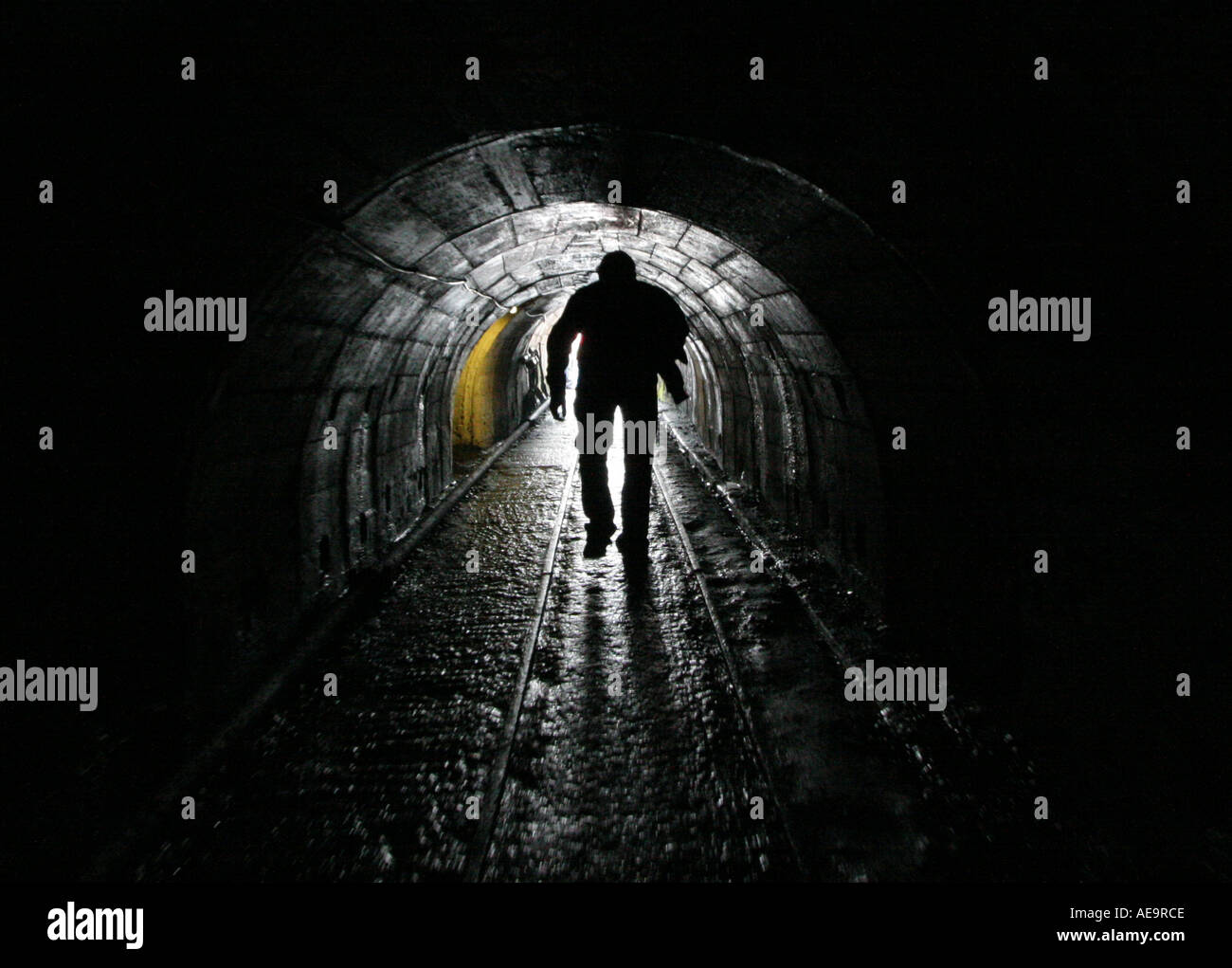 a man walking inside tunnel Stock Photo - Alamy