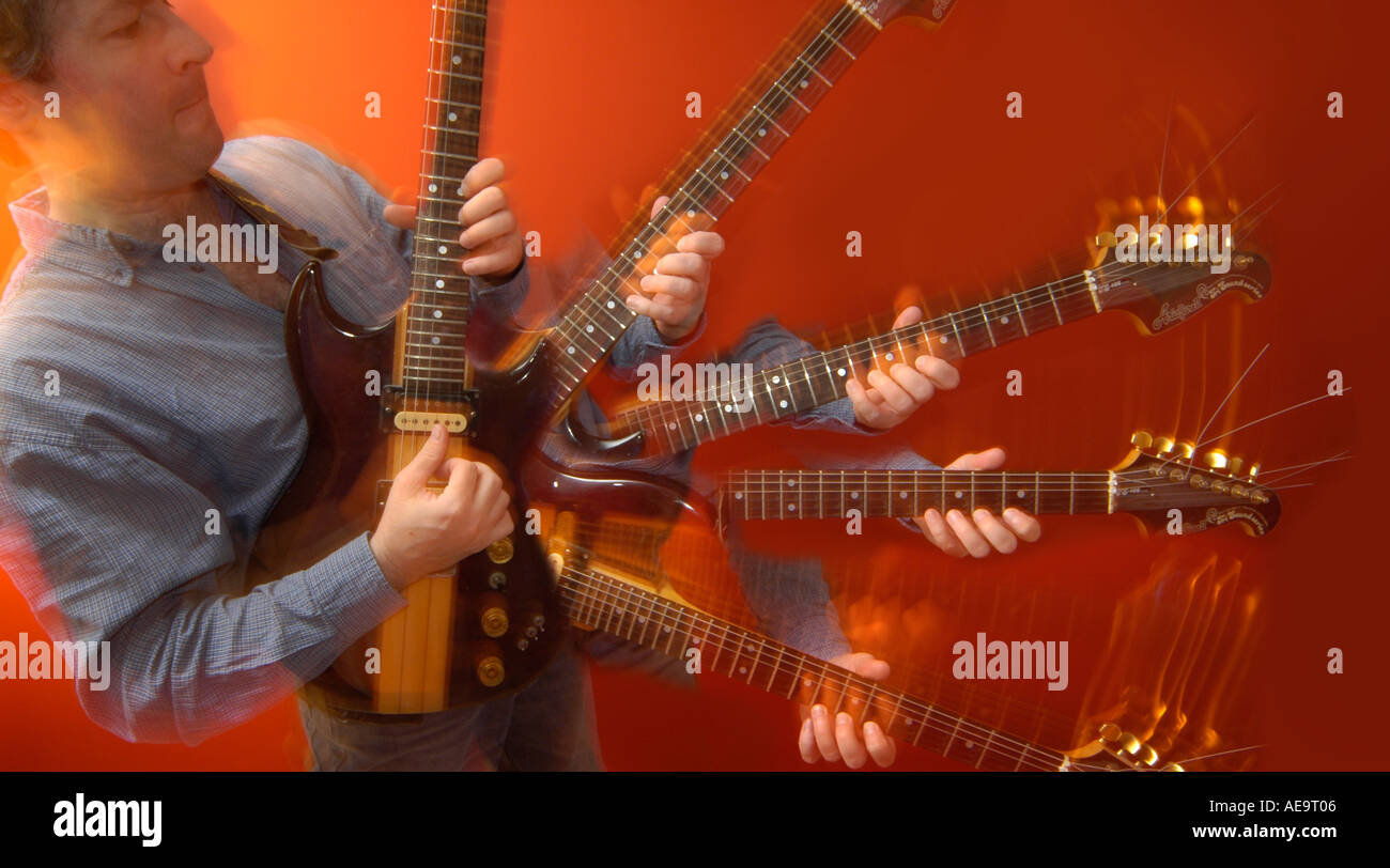 man male playing electric guitar showing motion movement against red ...