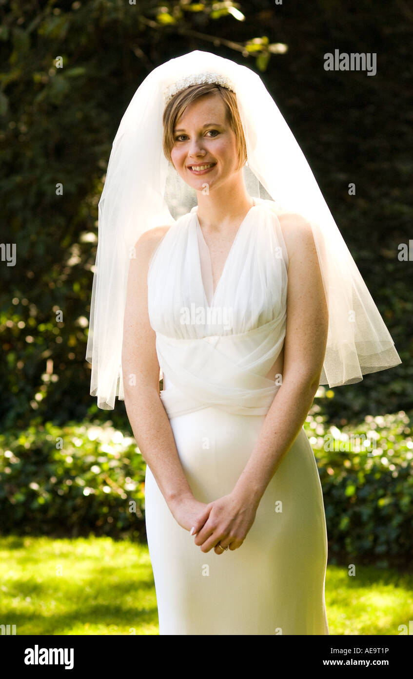Portrait of a bride on her wedding day backlit by the sun Stock Photo ...
