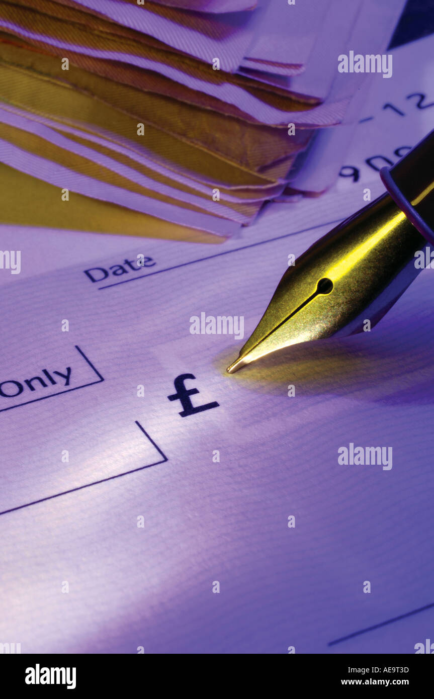 signing a bank cheque with pen Stock Photo - Alamy