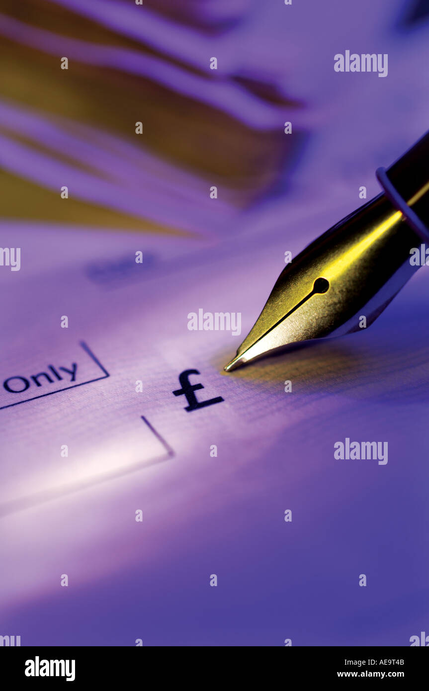 signing a bank cheque with pen Stock Photo - Alamy