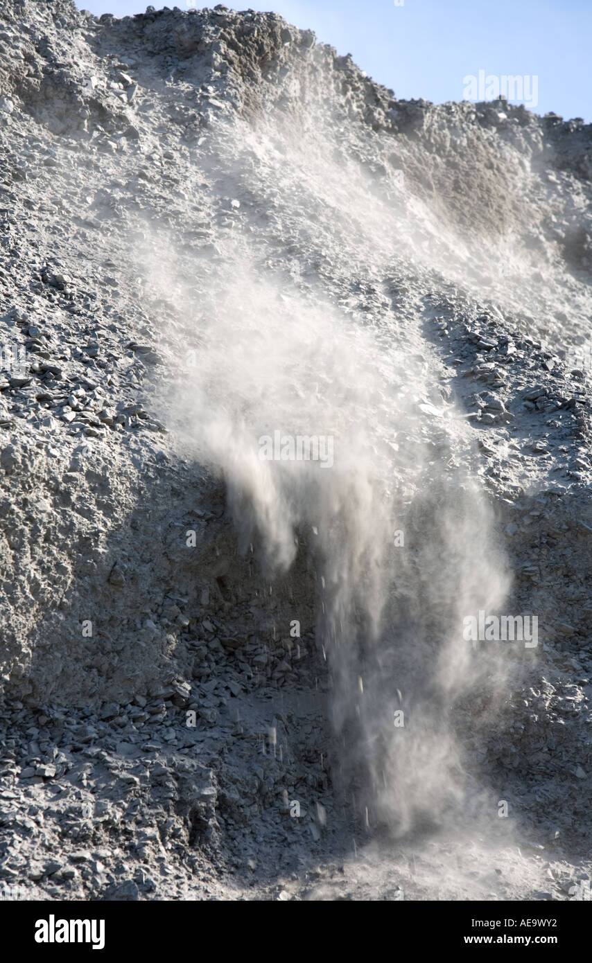 Falling rocks and stones from the wall of a gravel mound , Finland ...
