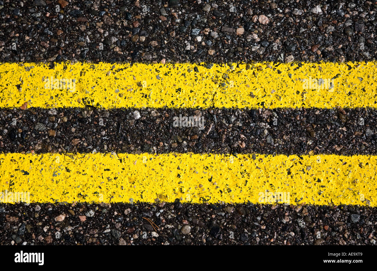 Two yellow barrier lines painted hi-res stock photography and images ...