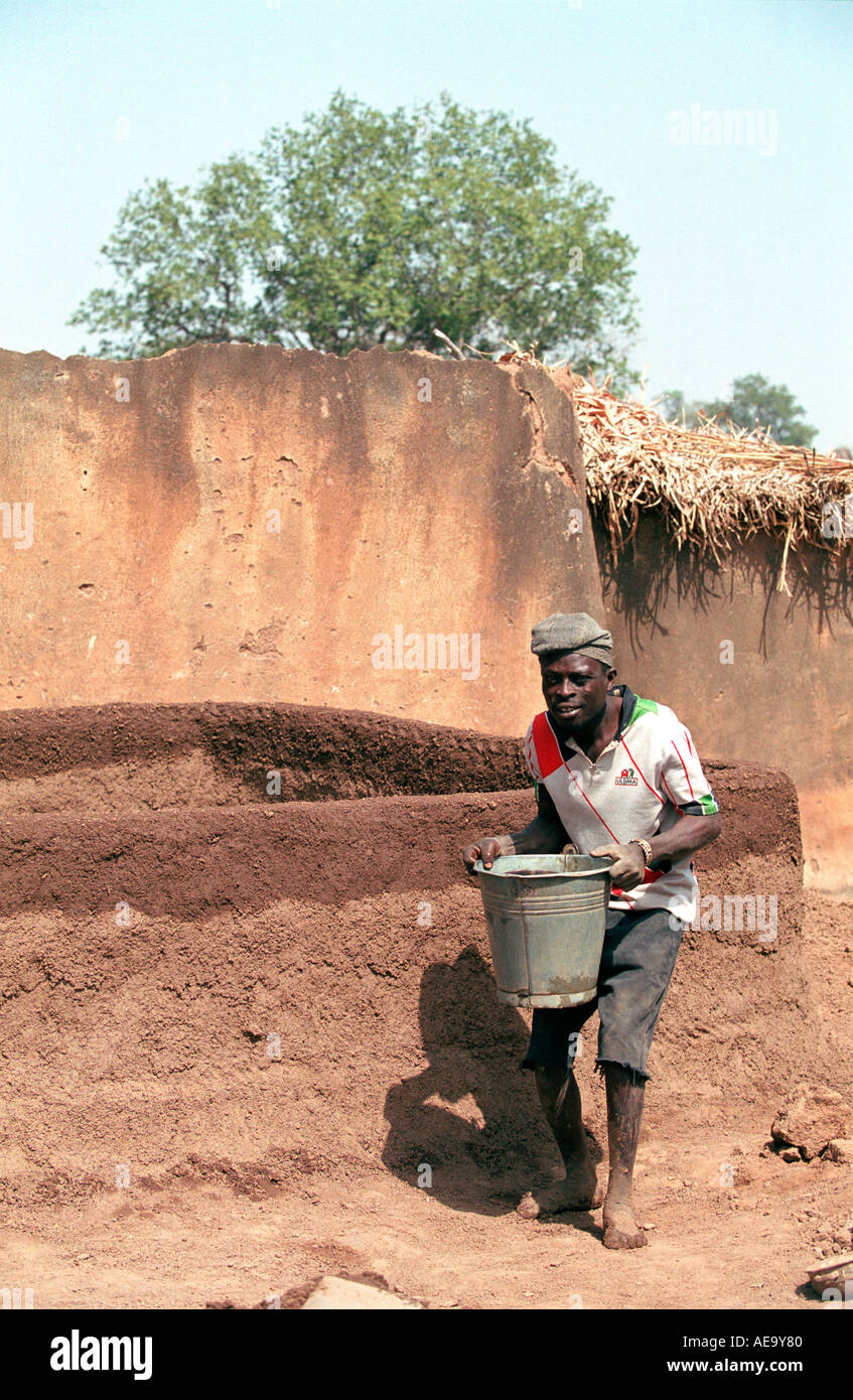 Man building his house at Tengzugu Stock Photo - Alamy