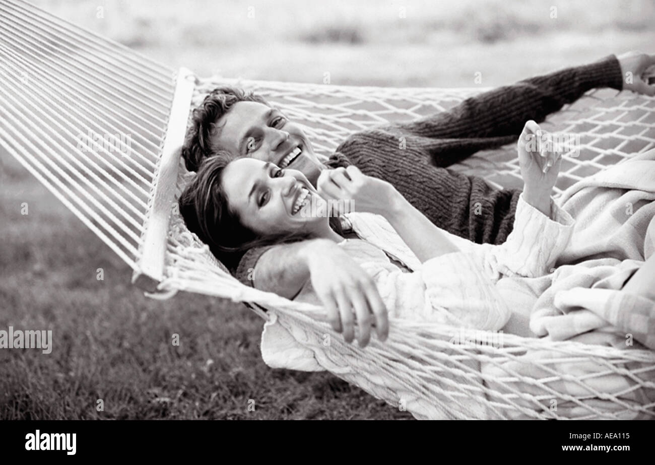 Couple cuddling hammock hi-res stock photography and images - Alamy