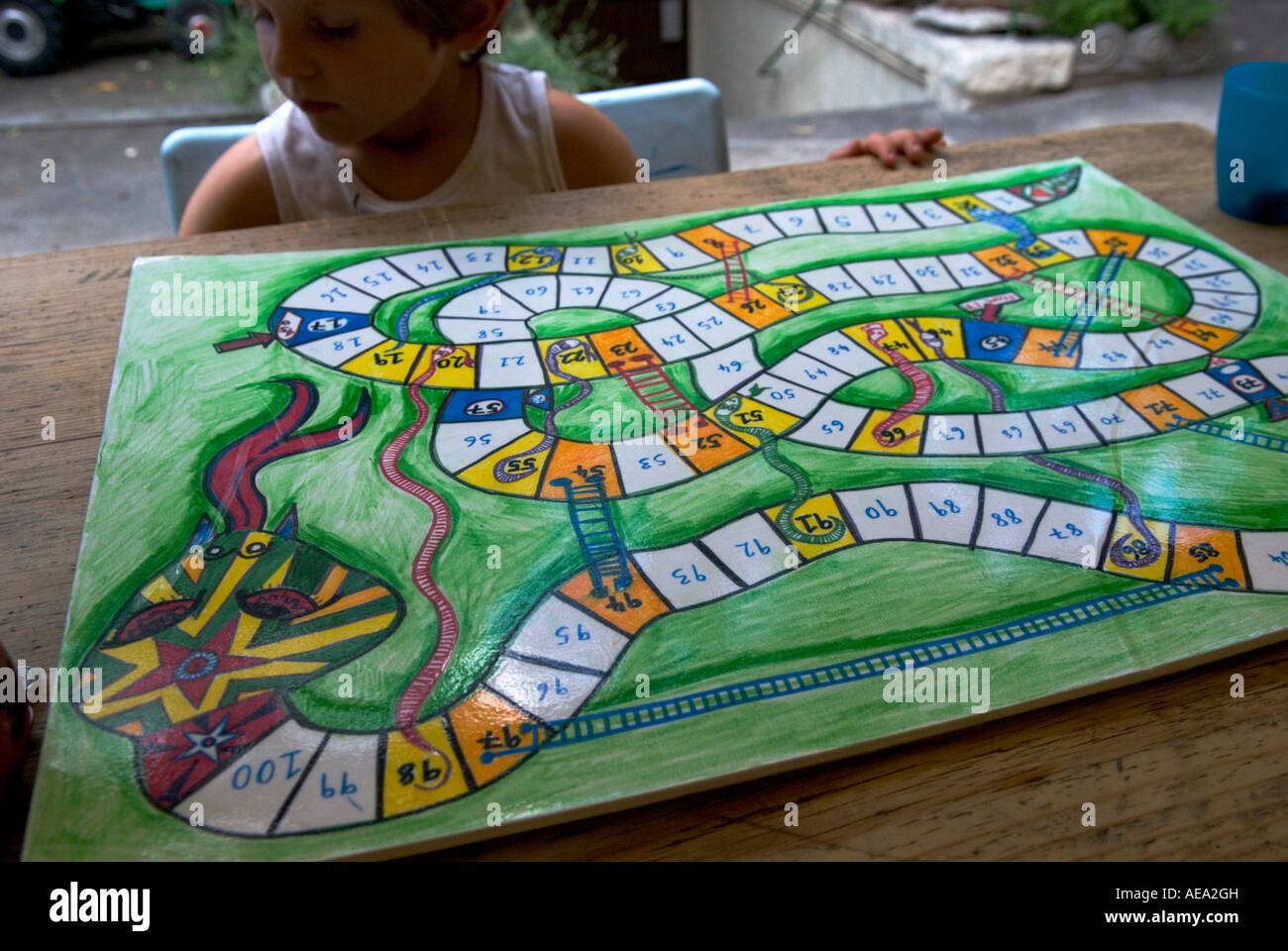 Children playing snakes and ladders hi-res stock photography and images ...