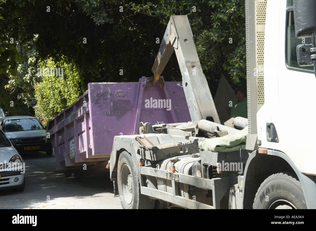 Truck unloading an empty container for building material waste Stock ...