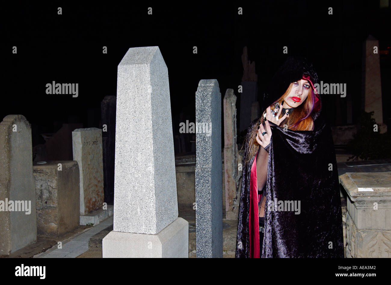 midnight in a cemetery a gothic dressed female model haunting a ...