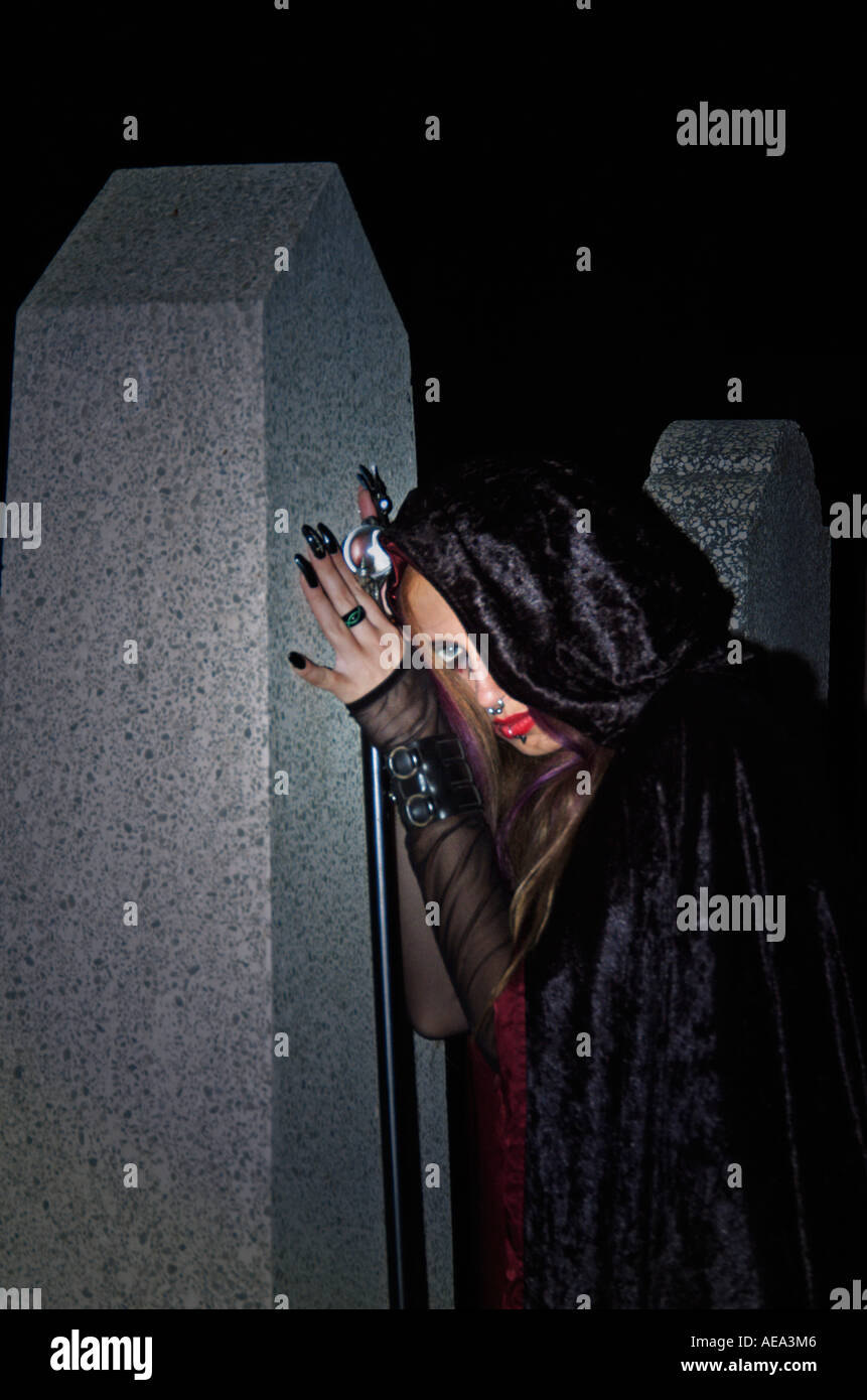 midnight in a cemetery a gothic dressed female model haunting a ...