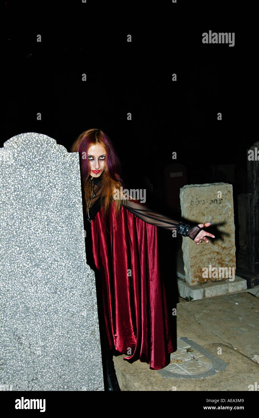 midnight in a cemetery a gothic dressed female model haunting a ...