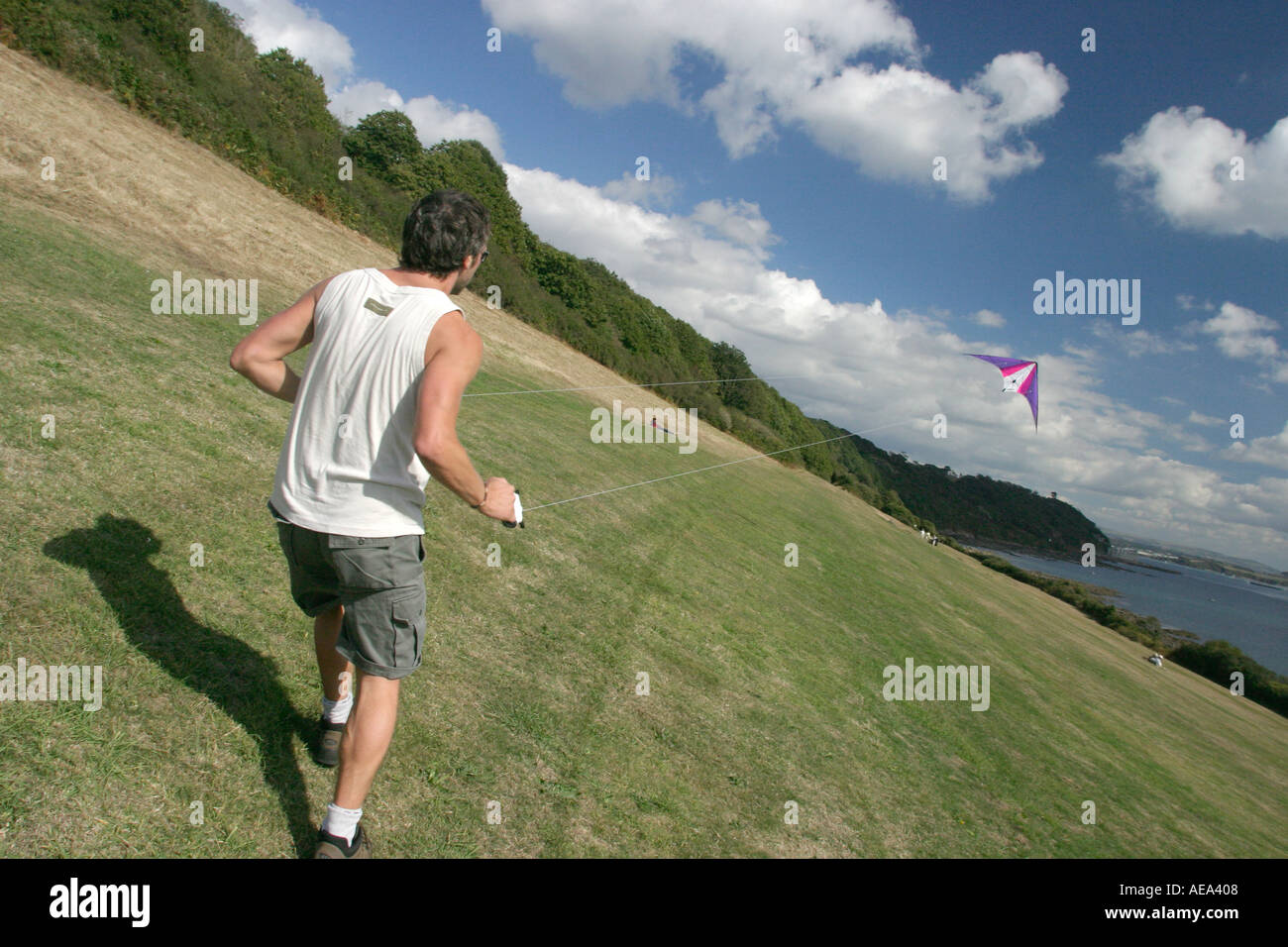 Man lifting kite hi-res stock photography and images - Alamy