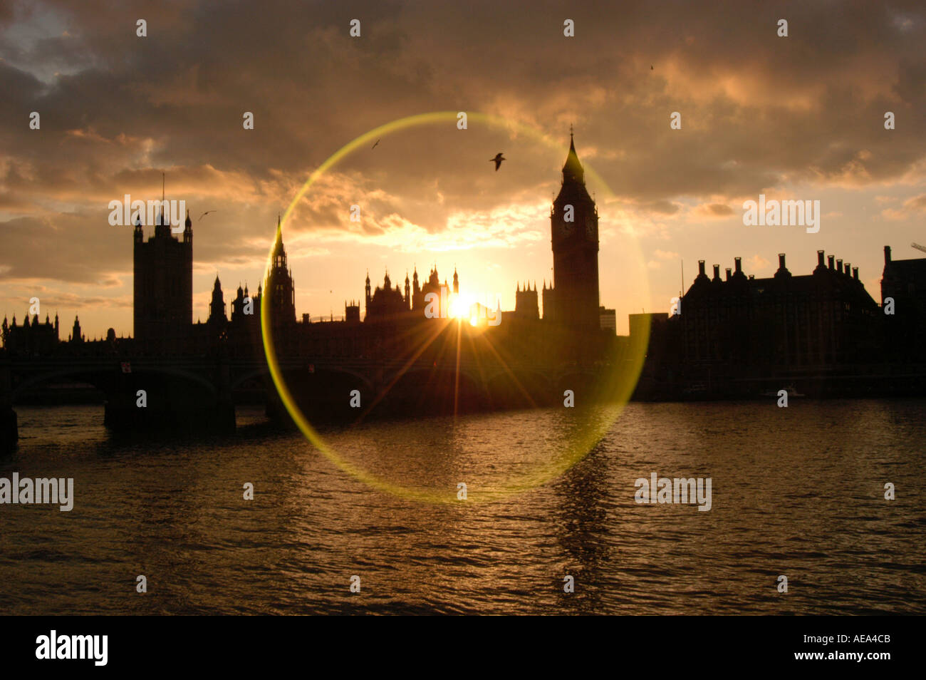 Sunset behind Big Ben with circular lens flare Stock Photo - Alamy