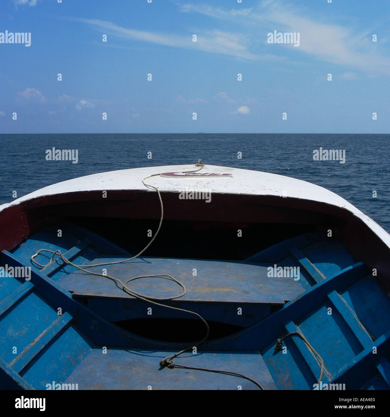 Boat heading towards the horizon Stock Photo - Alamy