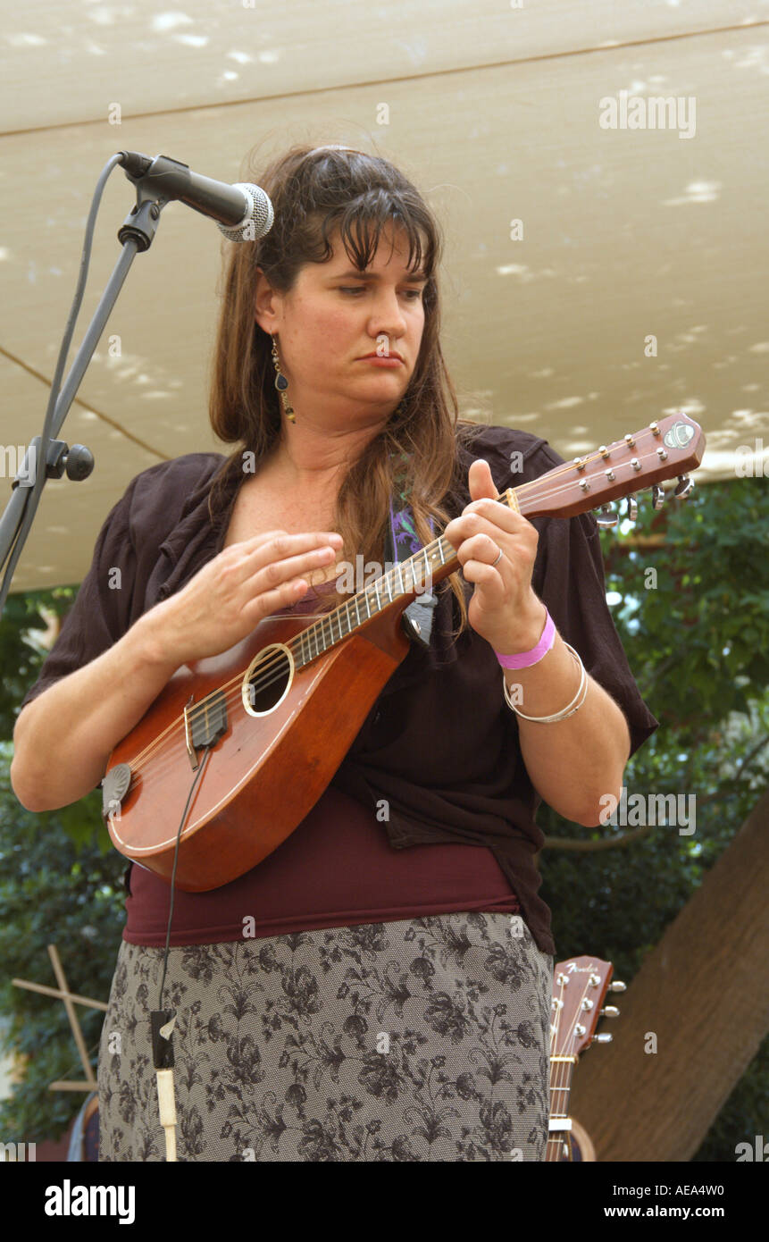 Woman playing mandolin hi-res stock photography and images - Alamy