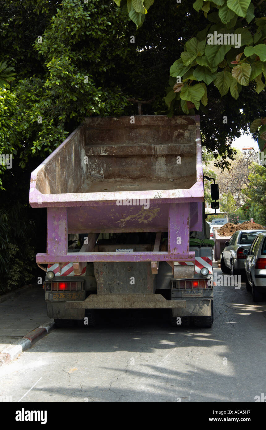 Truck unloading a container for building material waste Stock Photo - Alamy