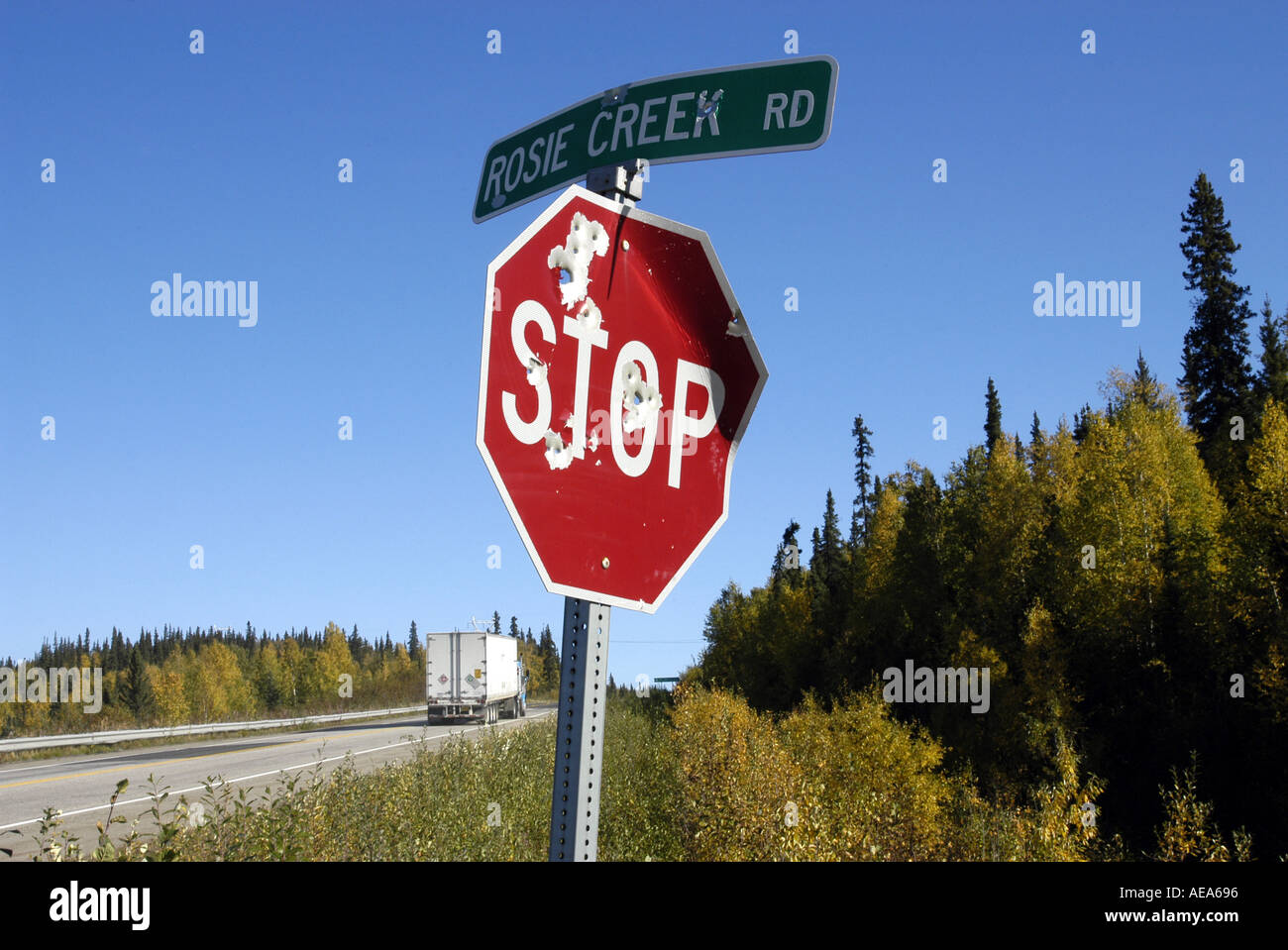 Road sign with bullet holes in it Alaska Stock Photo - Alamy