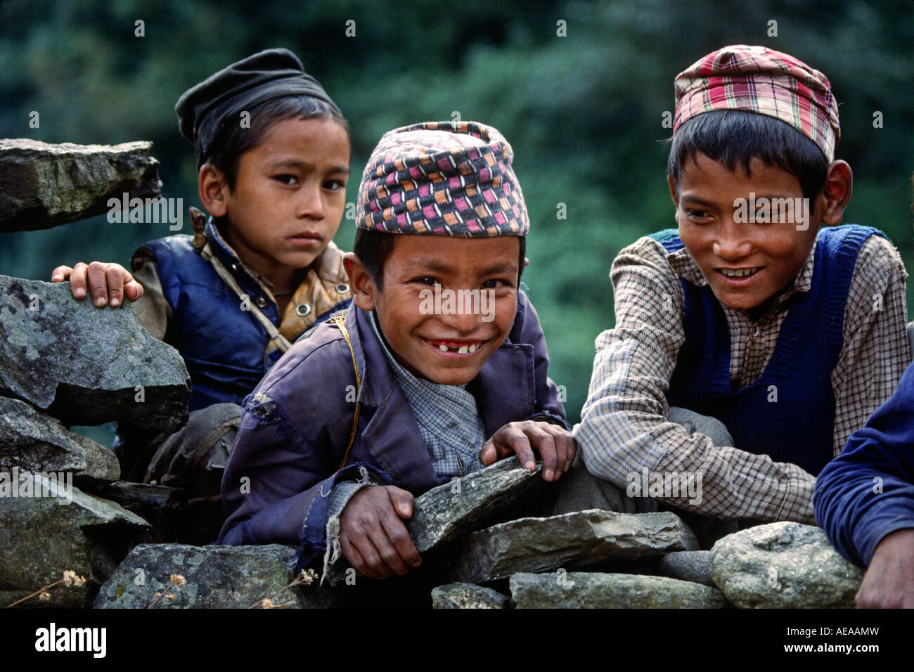 Chetri boys on a village wall SOLU TREK NEPAL Stock Photo - Alamy