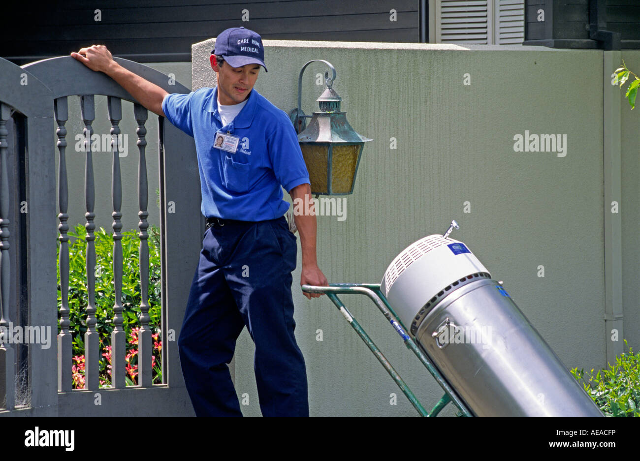 HEALTH CARE PROFESSIONAL delivers a BOTTLED OXYGEN to a home MR Stock ...