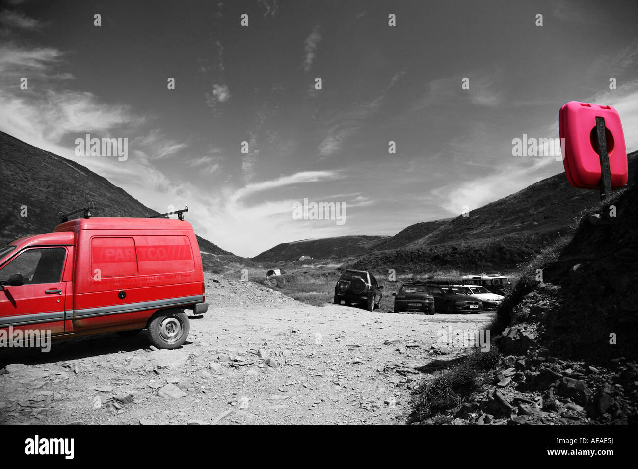 welcome bay in devon with a bright red van parked Stock Photo - Alamy