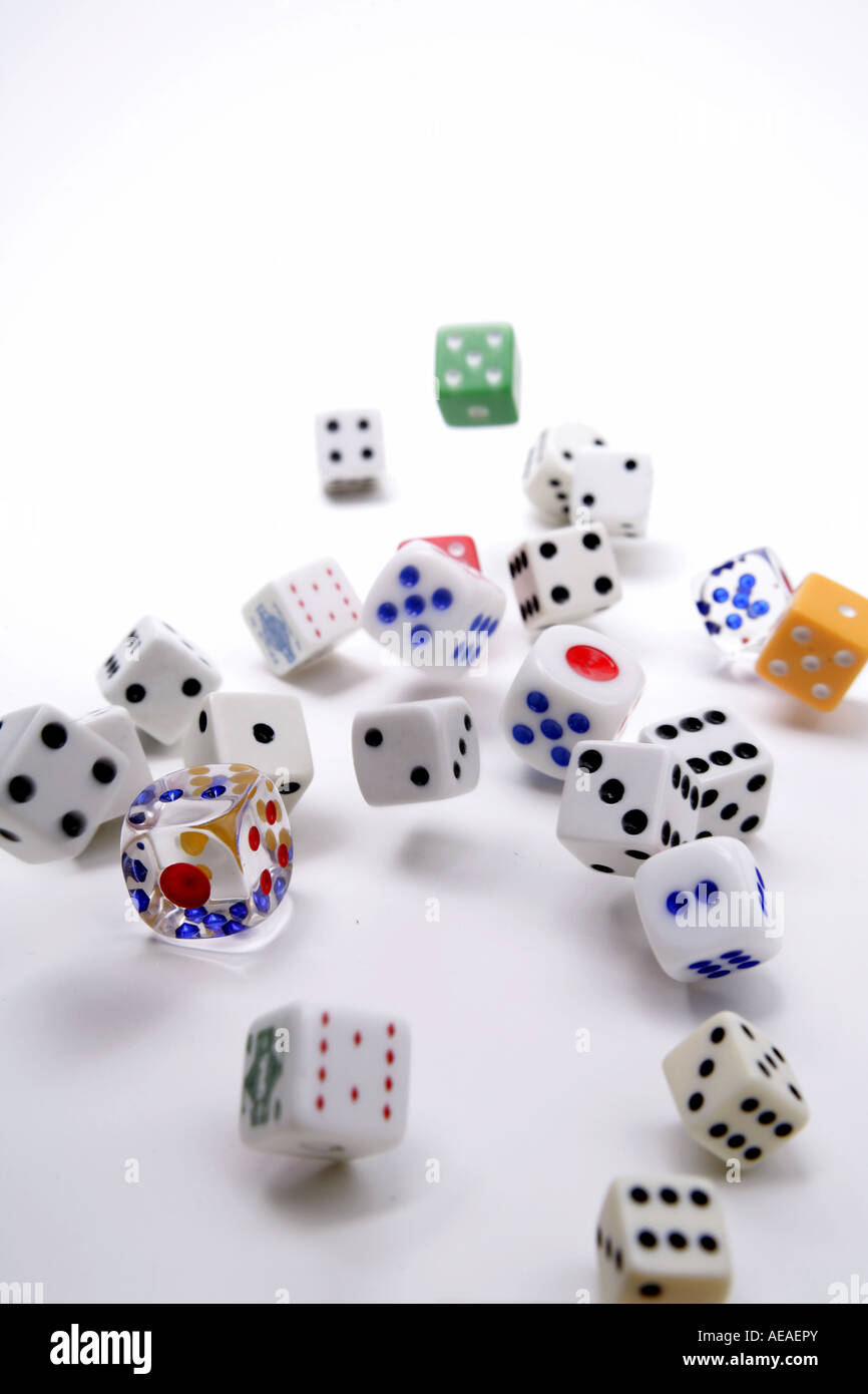 Dice tumbling on white background Stock Photo - Alamy