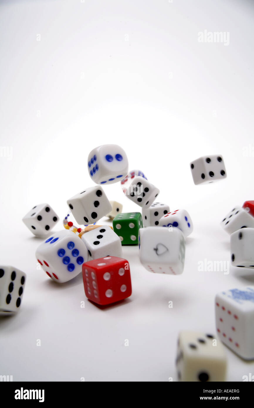 Dice rolling on white background Stock Photo - Alamy