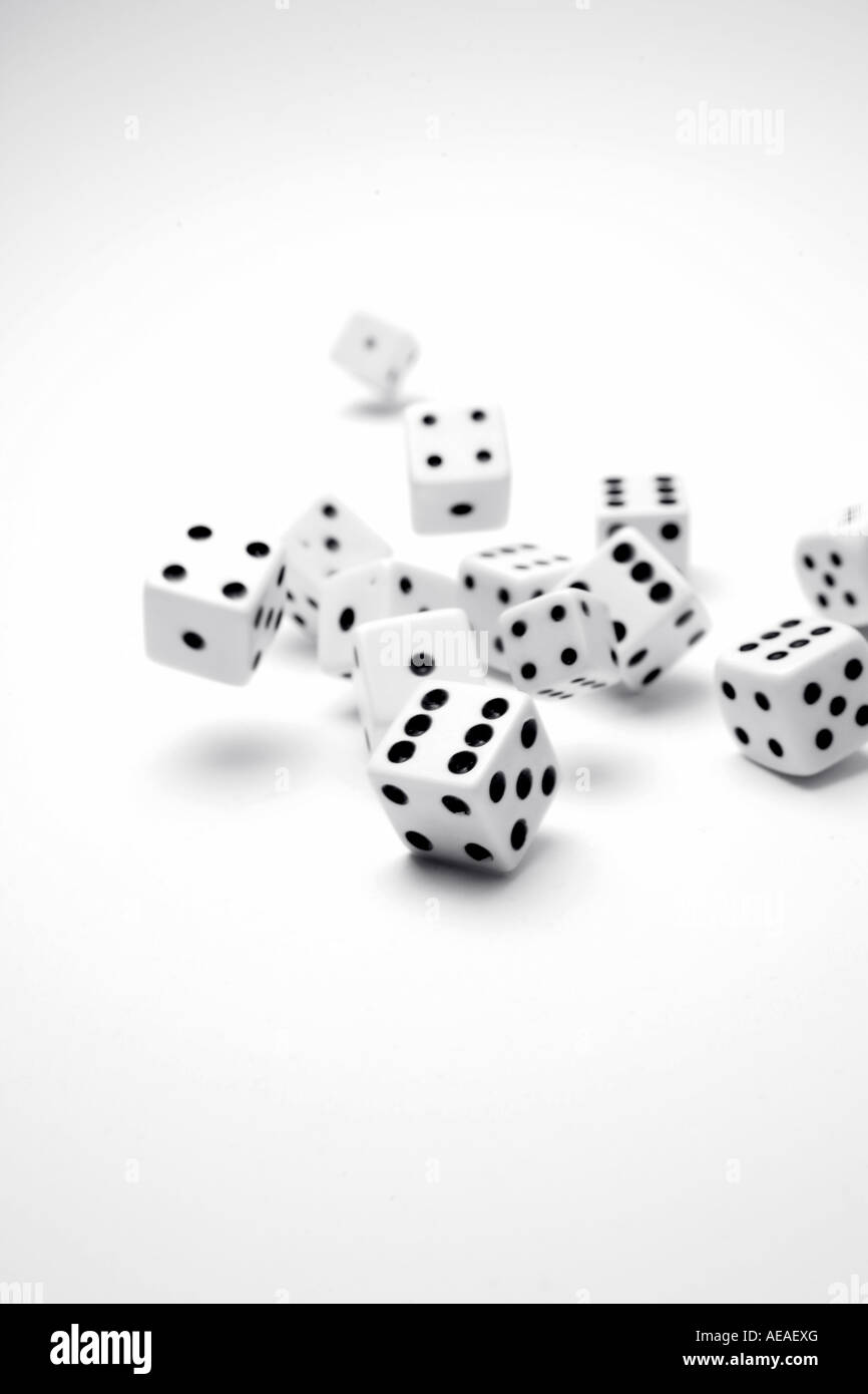 White dice rolling on white background Stock Photo - Alamy