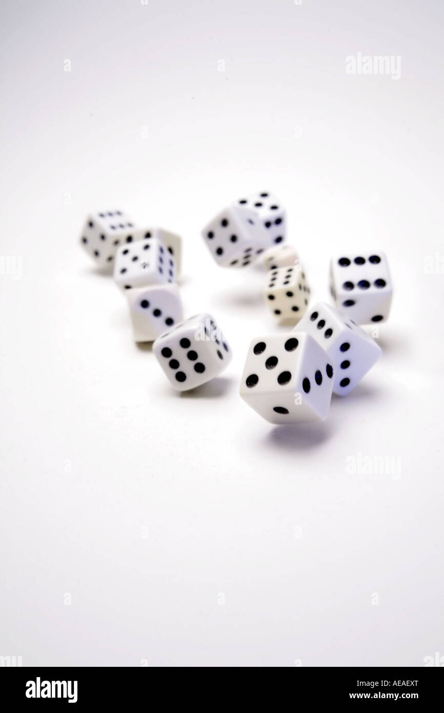Dice rolling on white background Stock Photo - Alamy
