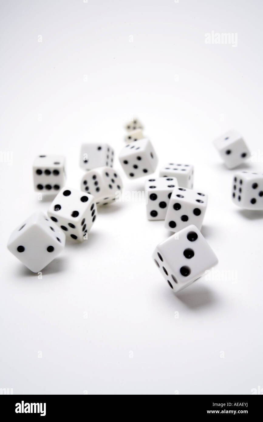 Lots of dice tumbling on white background Stock Photo - Alamy