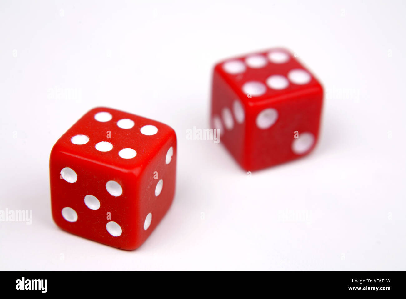 Two red dice isolated on white background Stock Photo - Alamy