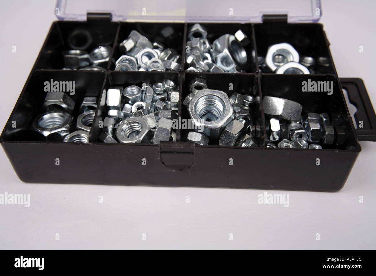 Nuts in plastic box Stock Photo - Alamy