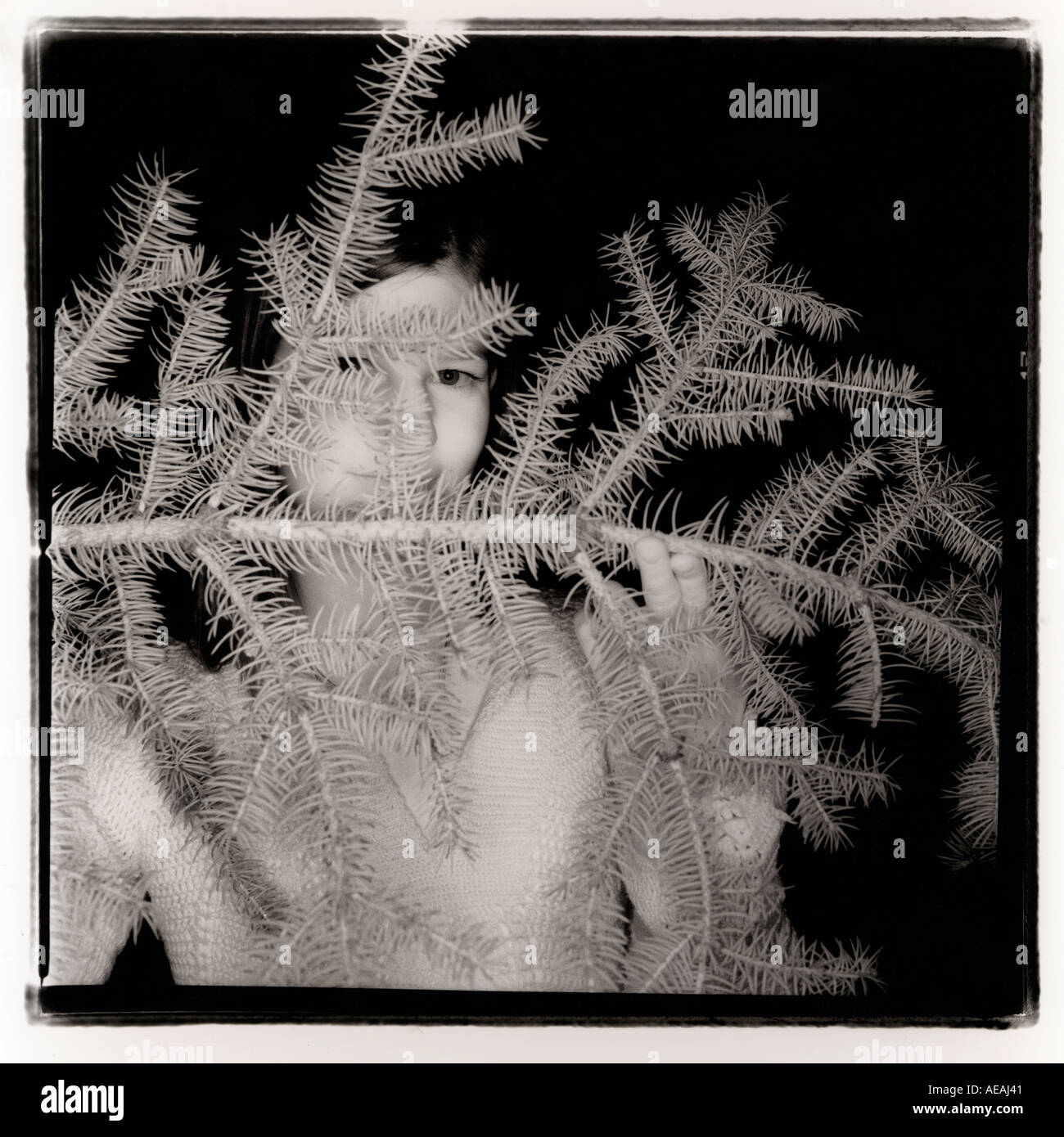 Infer red photograph of girl with tree branch Stock Photo - Alamy