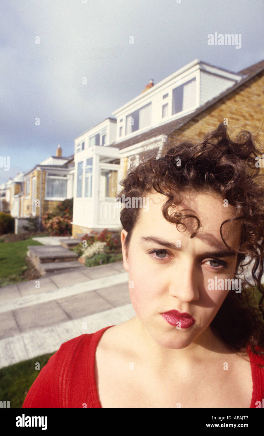 young angry looking girl woman with bright red lipstick in front of a ...