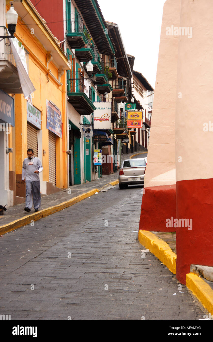 Colorful buildings on a steep, narrow, cobbled, historic city street in ...