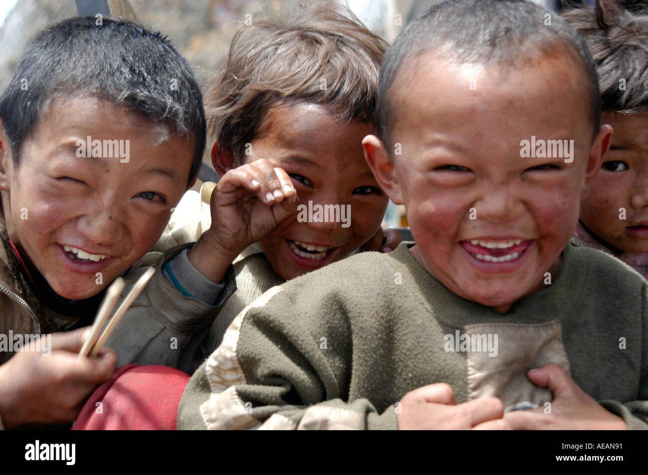 Tibetan children boys playing with chopsticks in Lhasa, Tibet ...
