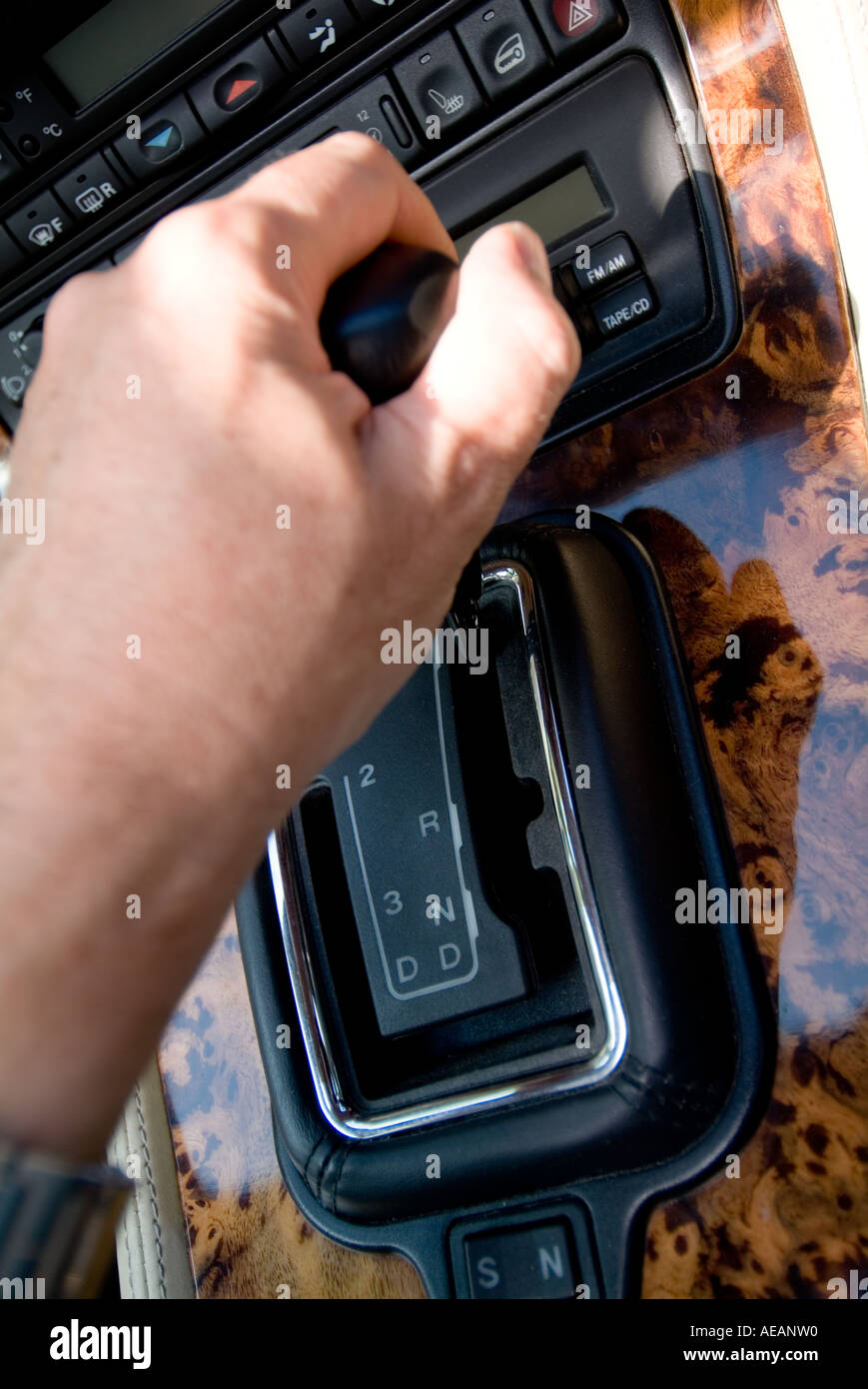hand on automatic gear shift in a car Stock Photo - Alamy