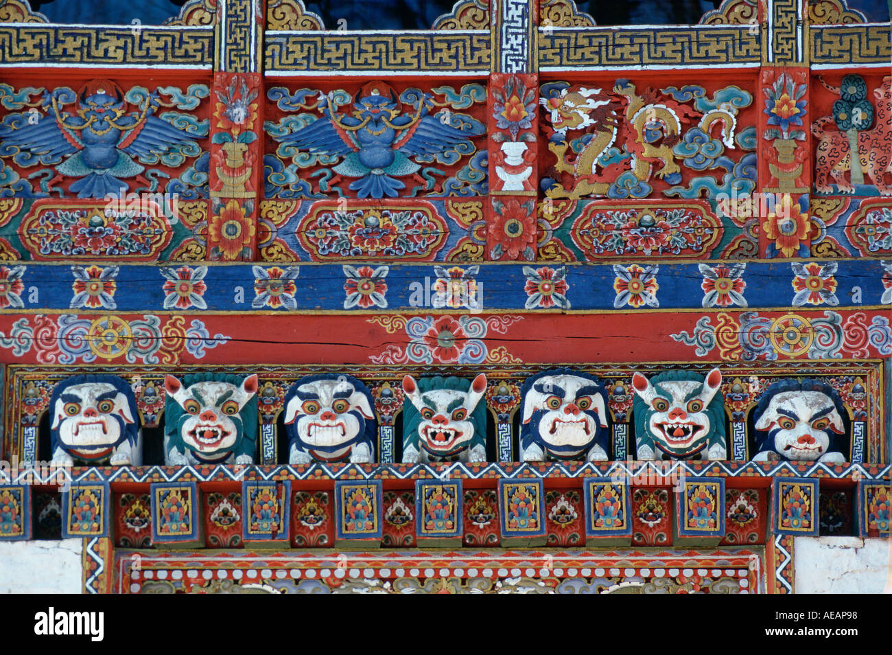 Traditional wood carving and decoration over a doorway at Ugyen Pelri ...