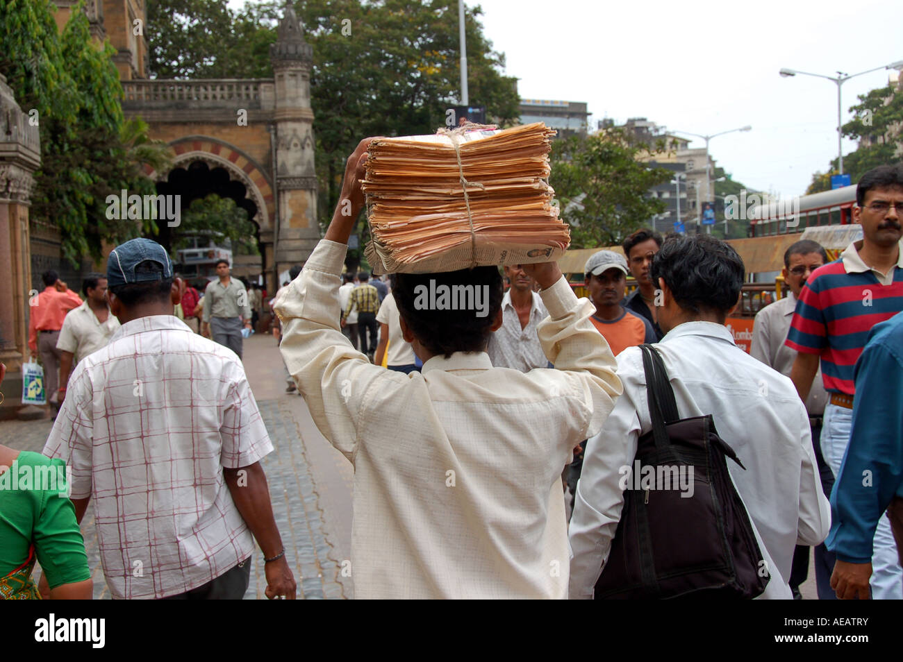 Man carrying newspapers in street in Mumbai / Bombay, India Stock Photo ...