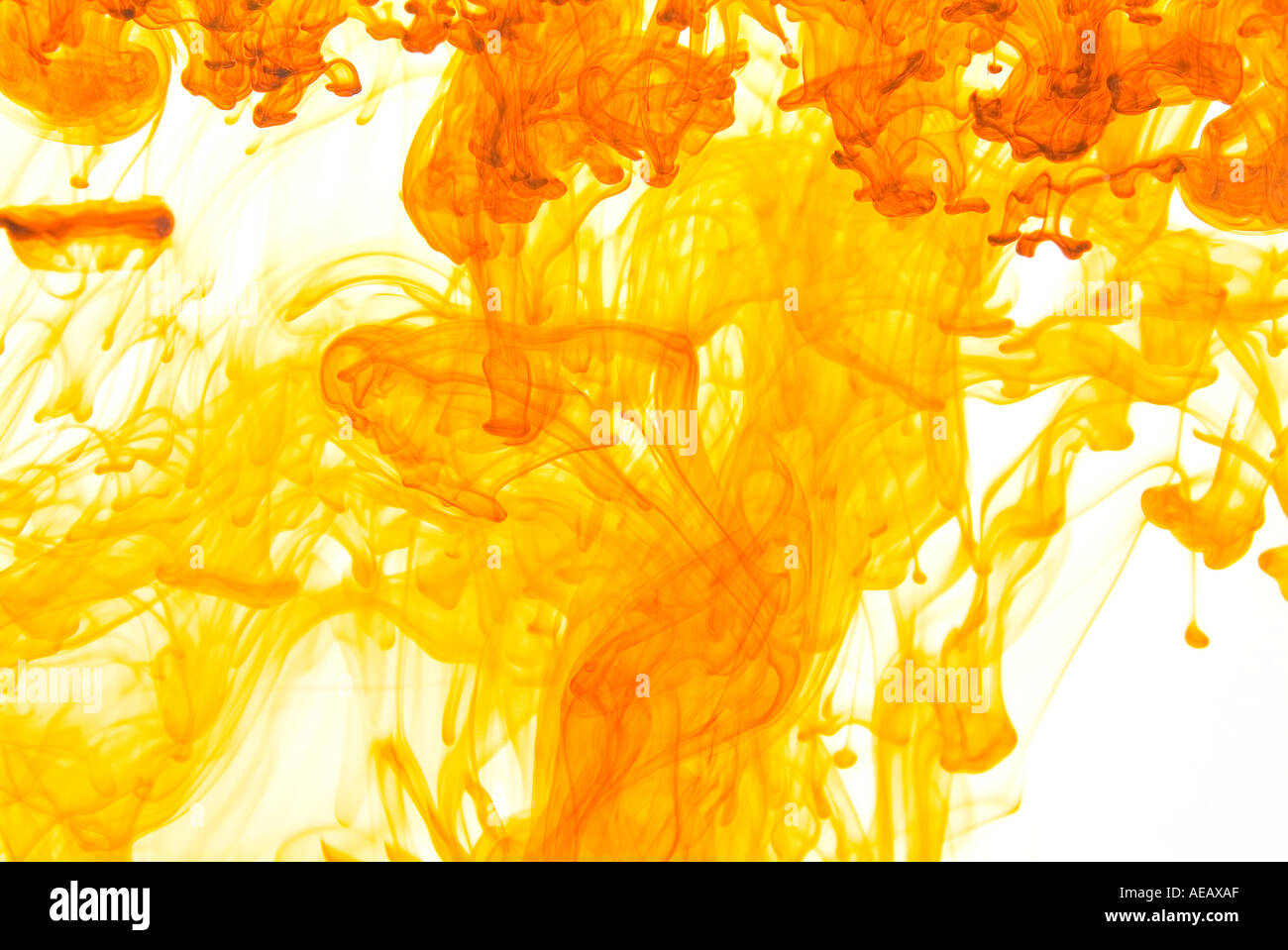 Coloured ink in water creating graphic swirling patterns Stock Photo ...