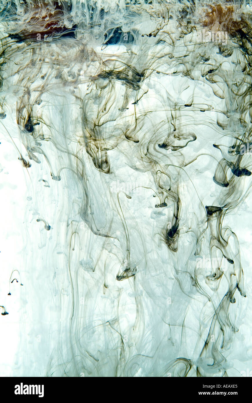 Coloured ink in water creating graphic swirling patterns Stock Photo ...