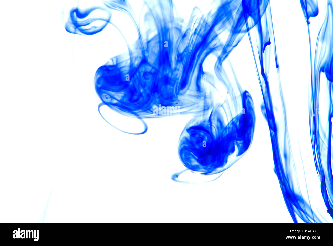 Coloured ink in water creating graphic swirling patterns Stock Photo ...