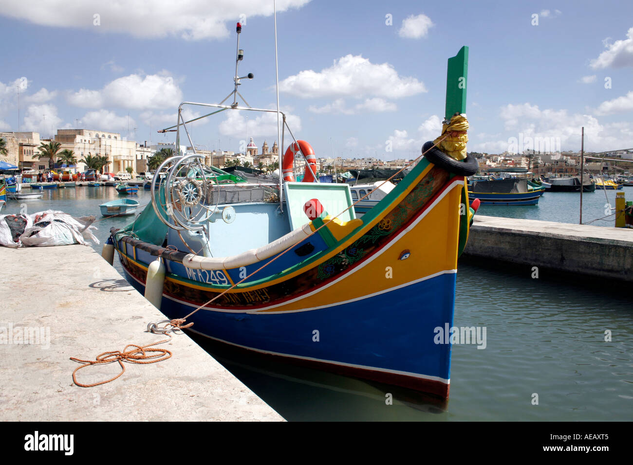 TRADITIONAL LUZZU FISHING BOAT MOORED IN MARSAXLOKK HARBOUR. MALTA ...